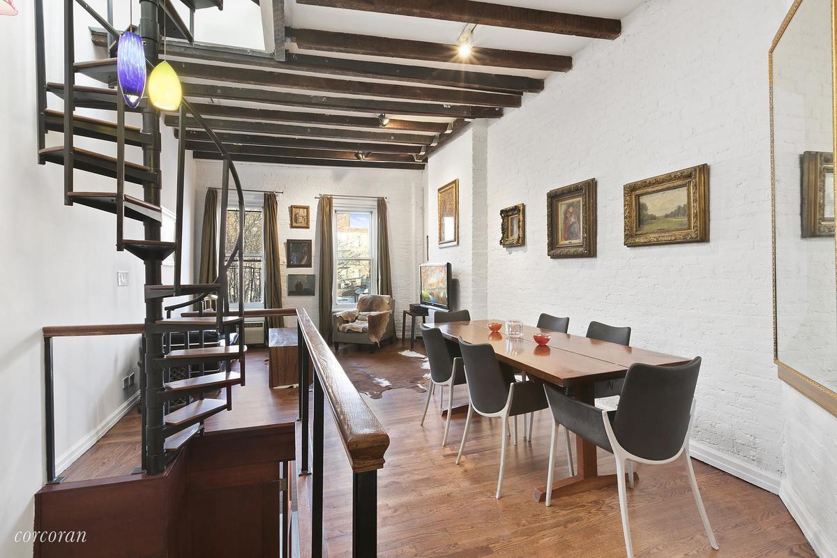 Beamed ceilings and a spiral staircase make a bold statement at this ...