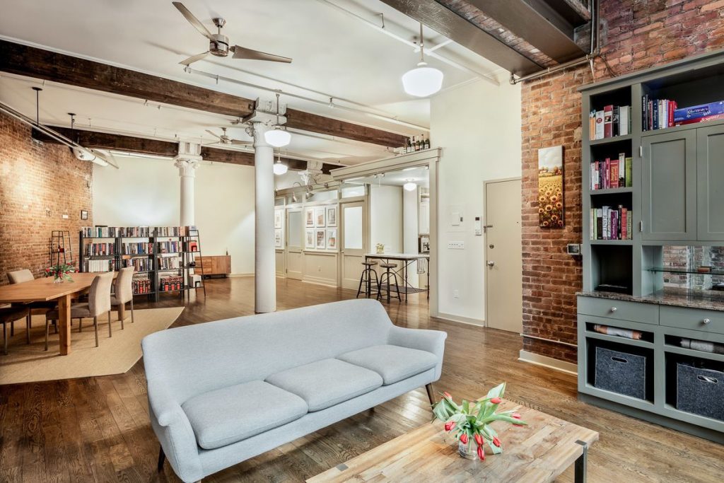 A wall of windows stuns at this $1.8M artsy loft in the heart of ...