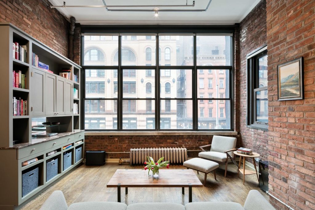 A wall of windows stuns at this $1.8M artsy loft in the heart of ...