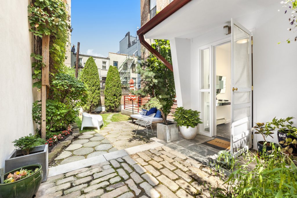 Walk outside to your private garden from all sides of this $1.85M ...
